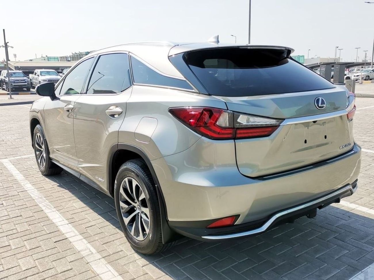 Used Lexus RX450H - Hybrid - 2022 - Gold 2022 for sale in Sharjah - 708273